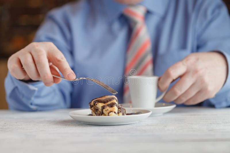 Man Eating Strawberry Cheesecake in Cafe Drinking Coffee Stock Image ...