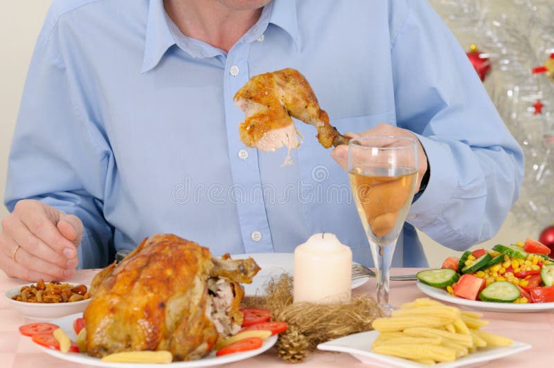 Man eating turkey stock image. Image of cheerful, room - 6632719