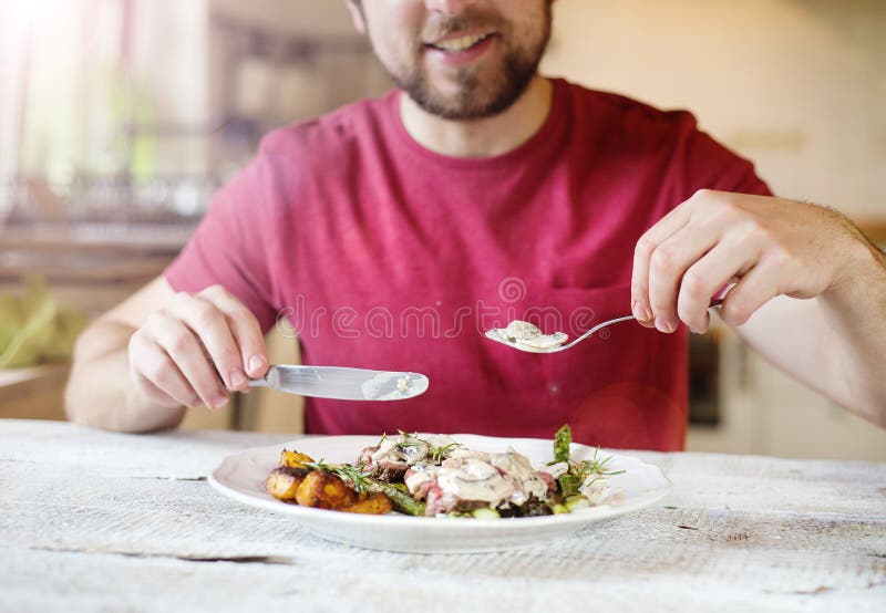 Man eating stock image. Image of herb, baked, indoors - 60166221