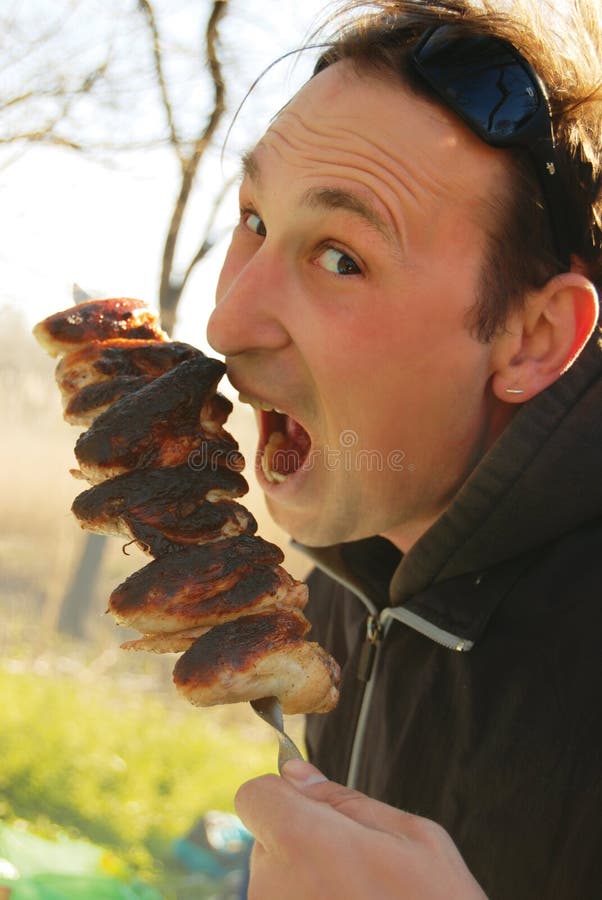 A man eating up meat stock image. Image of food, coal - 12553913