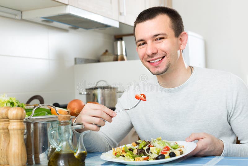 Man Eating Vegetable Salad in Kitchen. Stock Image - Image of portrait ...