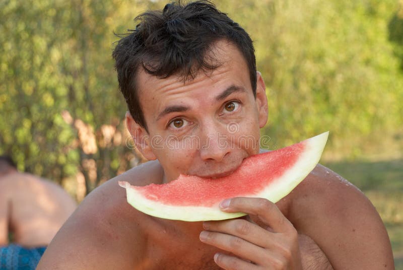 Man eating watermelon stock image. Image of domestic - 10989735