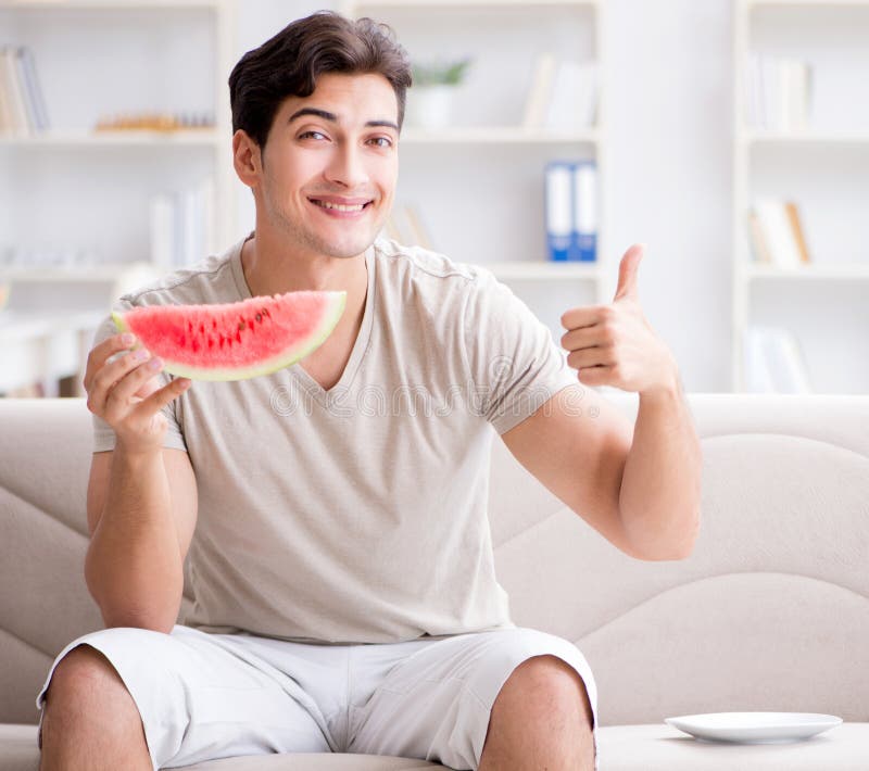 Man Eating Watermelon at Home Stock Photo - Image of food, lifestyle ...
