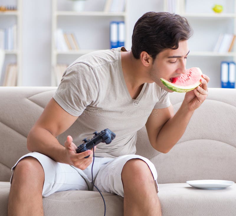 Man Eating Watermelon at Home Stock Photo - Image of diet, cheerful ...