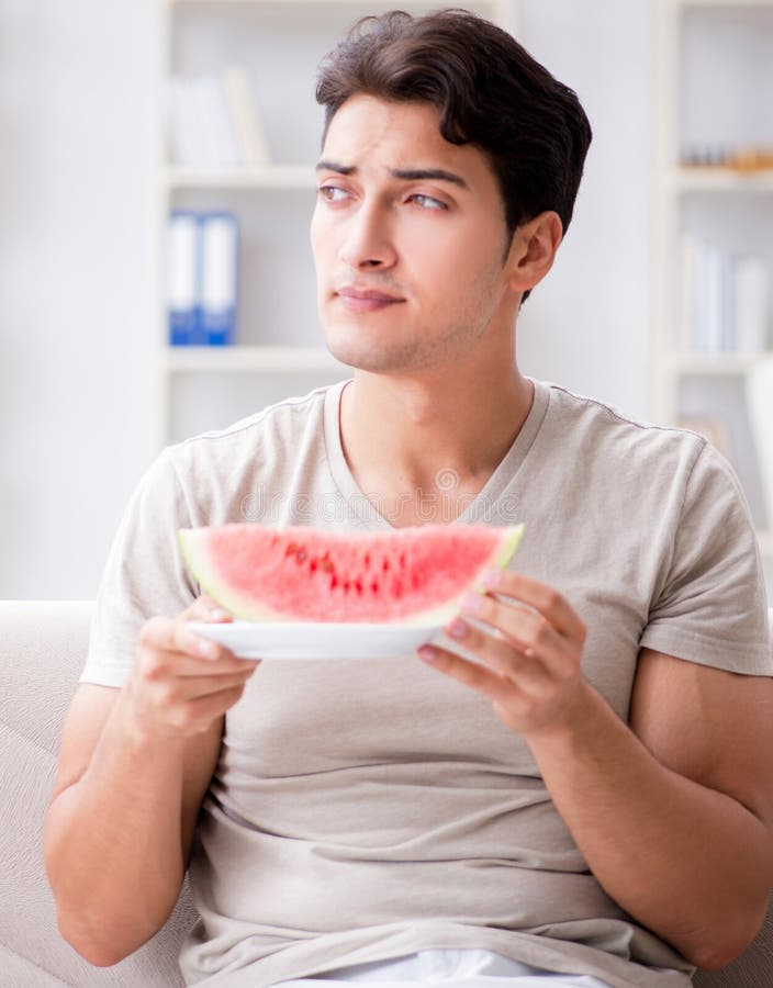 Man Eating Watermelon at Home Stock Image - Image of organic, juicy ...