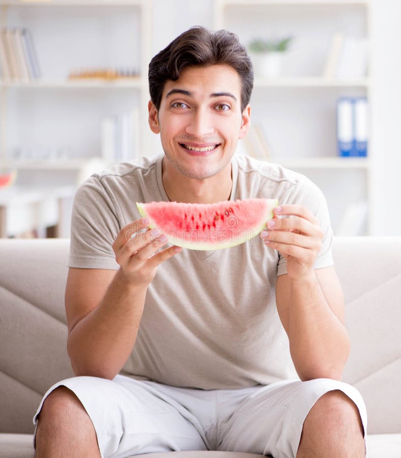 Man Eating Watermelon at Home Stock Image - Image of lifestyle, piece ...