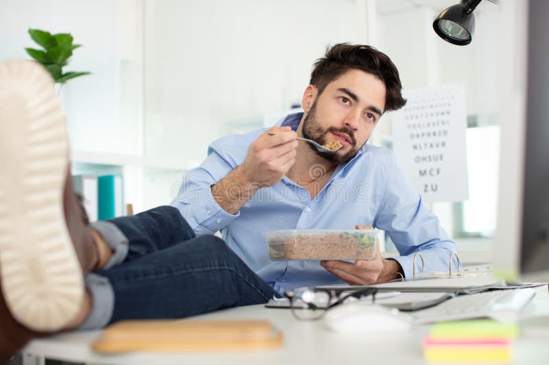 Man with feet on the table stock image. Image of blue - 36896741