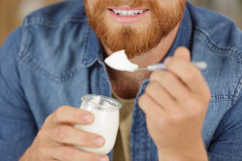 Man eating yogurt stock photo. Image of mustache, refreshment - 235482754