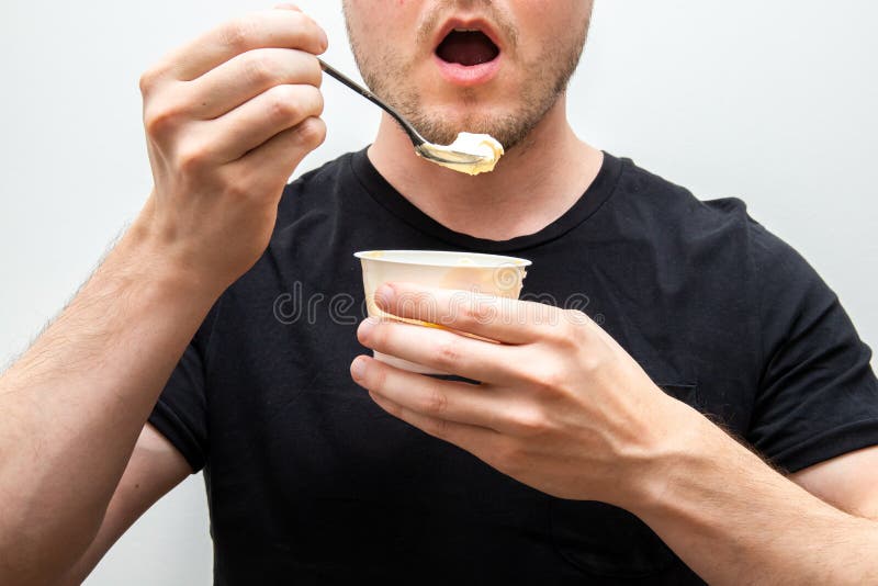 Man is Eating Yogurt; Healthy Lifestyle Concept Stock Photo - Image of ...