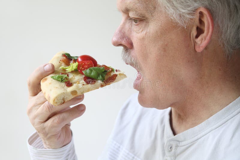 Man Eats BLT Pizza Profile View Stock Image - Image of food, tomato ...