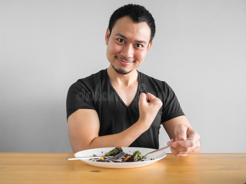Man eats healthy food. stock image. Image of nutrition - 100590231