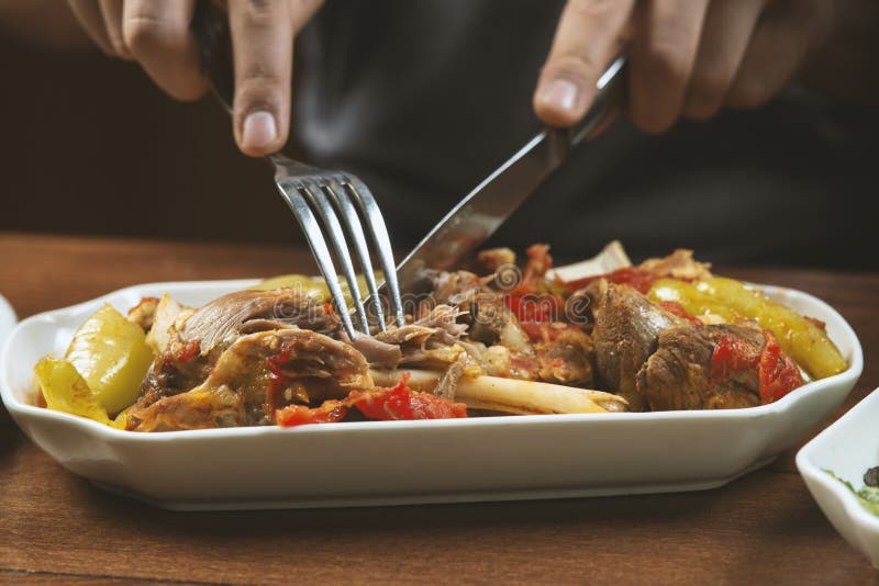 Man Eats Lamb Stew on the Bone with Vegetables Stock Image - Image of ...