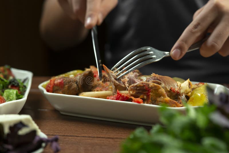 Man eats lamb stew stock photo. Image of pepper, braised - 177635704