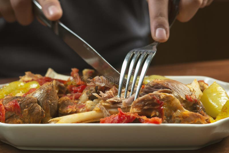 Man Eats Lamb Stew on the Bone with Vegetables Stock Image - Image of ...