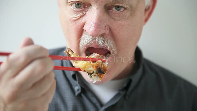 Man eats shrimp tempura stock footage. Video of chewing - 36052839