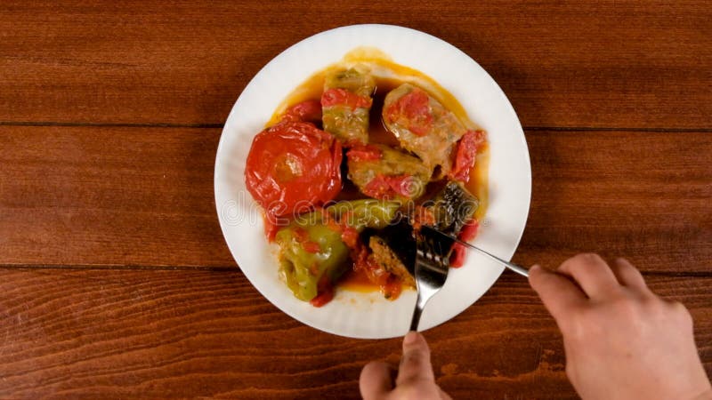 A Man Eats Summer Dolma, Cabbage, Eggplants, Peppers and Tomatoes ...