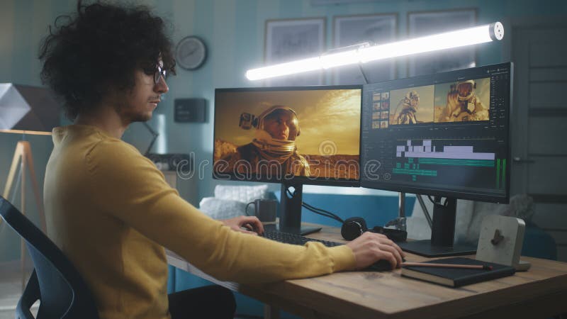 Man editing video at home stock photo. Image of work - 234882980