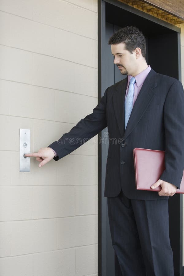 Businessman at elevator stock photo. Image of elevator - 10867092
