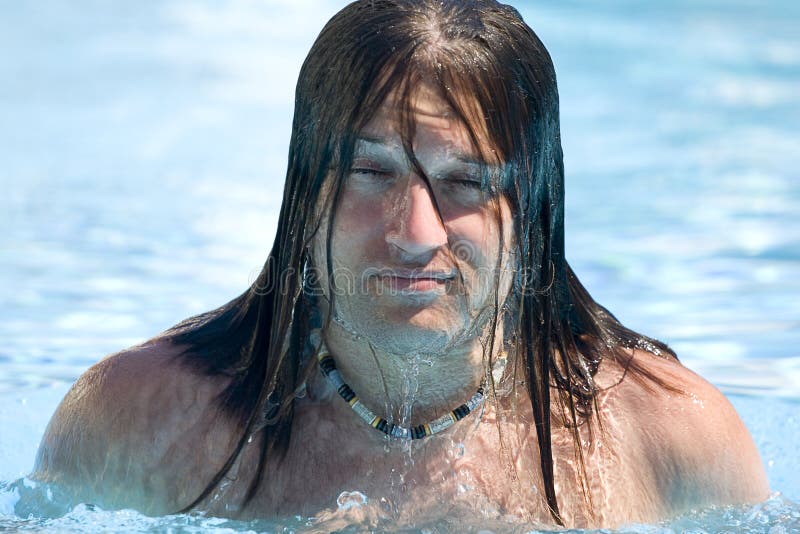 Man Emerges from Water and the Water Runs Down His Face Stock Photo ...