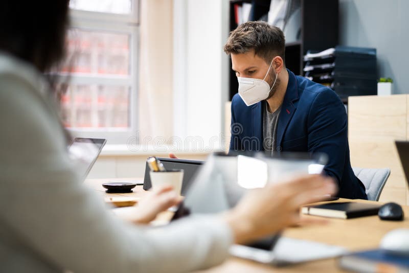 Man Employee In Office Wearing Face Mask Working Stock Image - Image of ...
