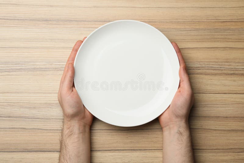 Man with Empty Plate at Wooden Table Stock Photo - Image of diet, clean ...