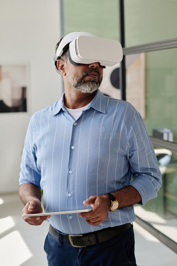 Experiencing Virtual Reality Wearing VR Headset in Office Stock Photo ...
