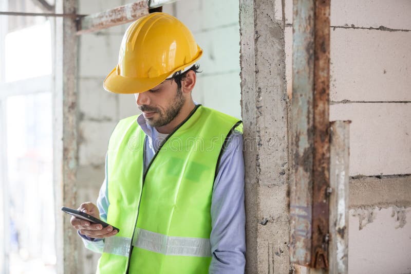 Man Engineer Builder House Construction Using Smartphone. Male ...