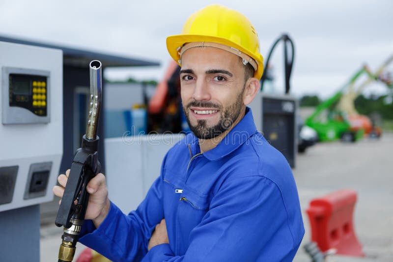 Man engineer doing petrol stock image. Image of power - 326322537