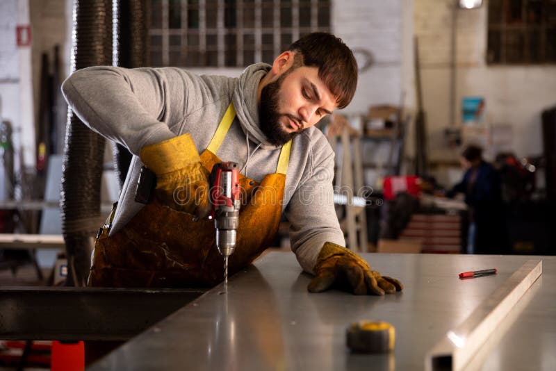 Man Engineer Drilling Metal Sheet in Workshop Stock Image - Image of ...