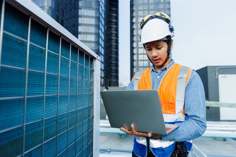 Man Engineer Holding Laptop Working at Rooftop Building Construction ...