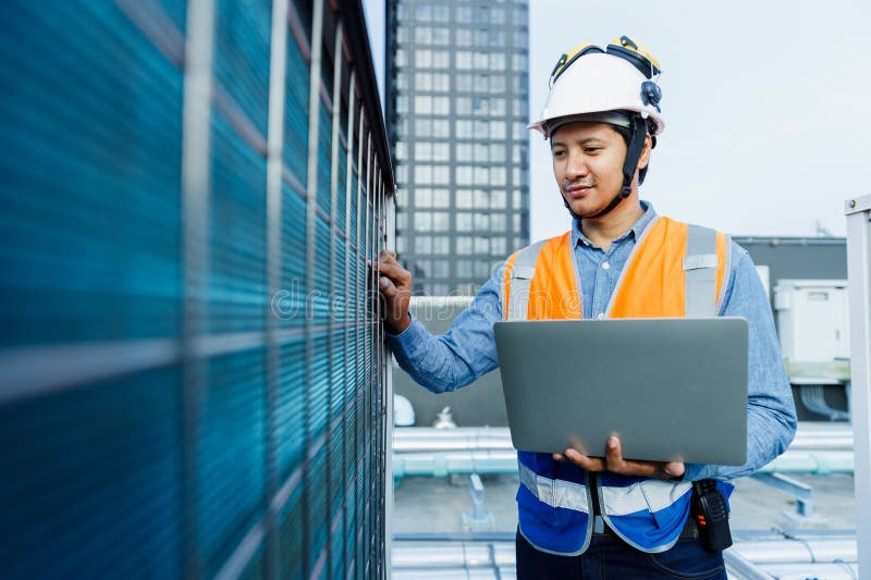 Man Engineer Holding Laptop Working at Rooftop Building Construction ...