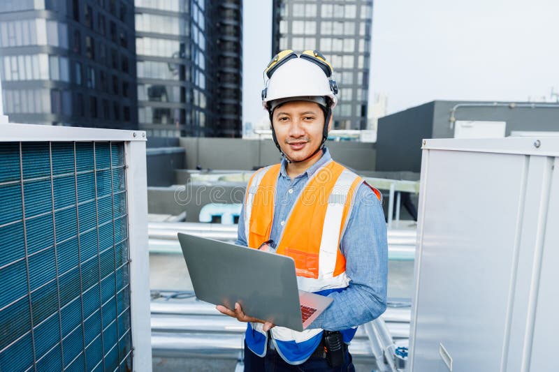 Man Engineer Holding Laptop Working at Rooftop Building Construction ...