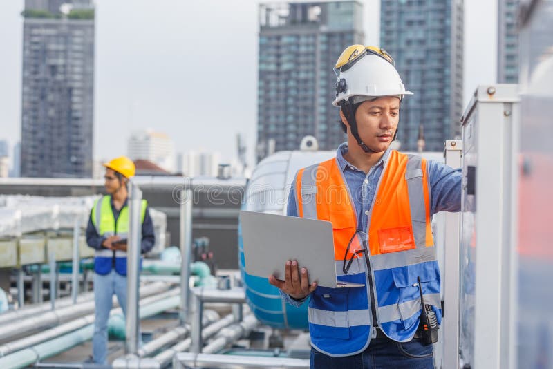 Man Engineer Holding Laptop Working at Rooftop Building Construction ...