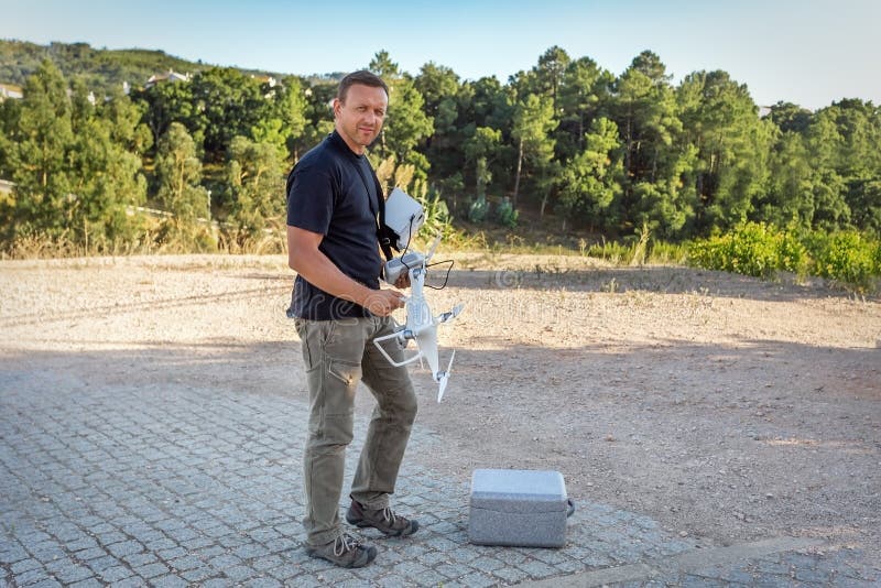 Man, an Engineer Pilot, a Drone, Prepares Air Device for Take-off, for ...