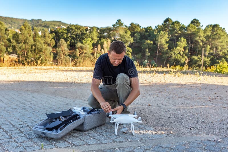 Man, an Engineer Pilot, a Drone, Prepares Air Device for Take-off, for ...