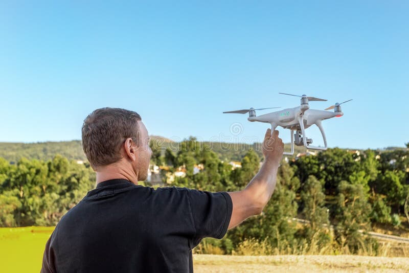 Man, an Engineer Pilot, a Drone, Prepares Air Device for Take-off, for ...