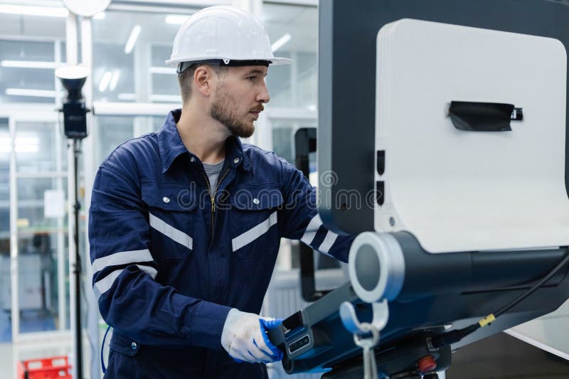 Man Engineer Using Computer Controlling Cnc Machine at Workshop ...