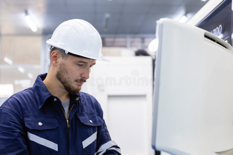 Man Engineer Using Computer Controlling Cnc Machine at Workshop ...