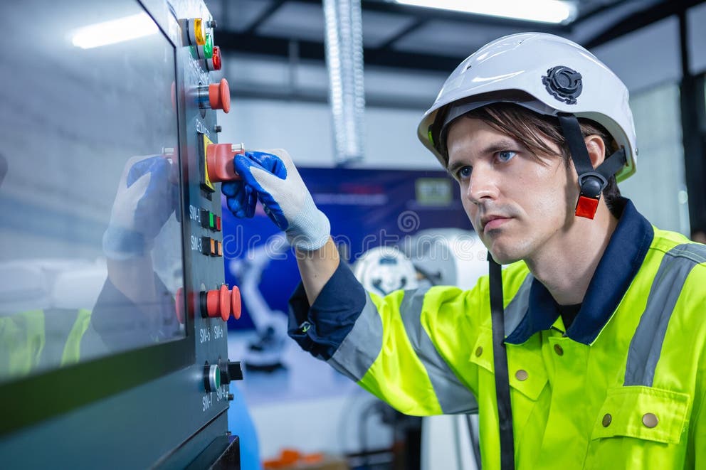 Man Engineer Using Computer Controlling Machine Automation Robotics at ...