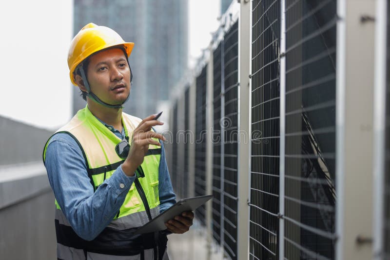 Man Engineer Using Tablet Working at Rooftop Building Construction. Male Technician Worker ...