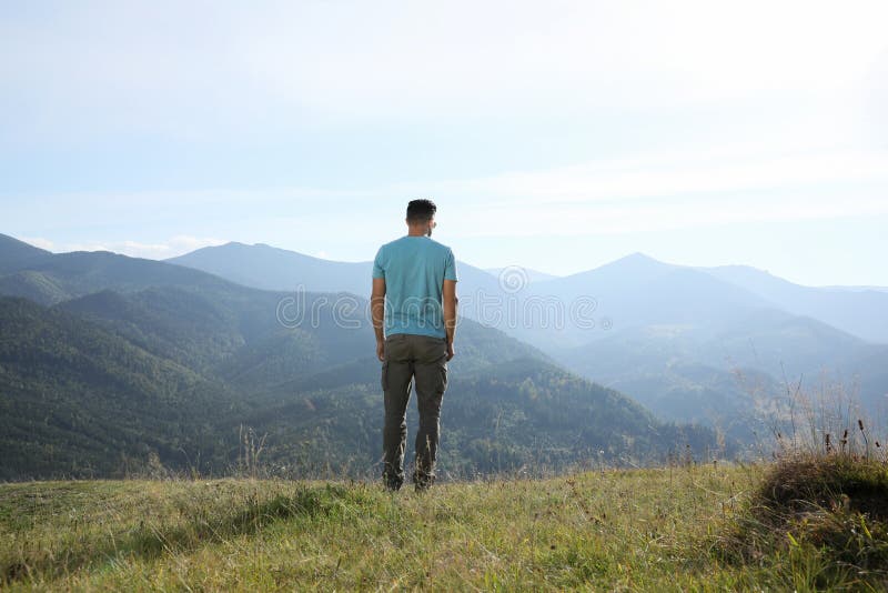 Man Enjoying Beautiful Mountain Landscape, Back View Stock Photo ...