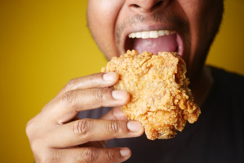 Man Enjoying Fried Chicken, Mouth Open, Savoring Every Bite with a Big ...