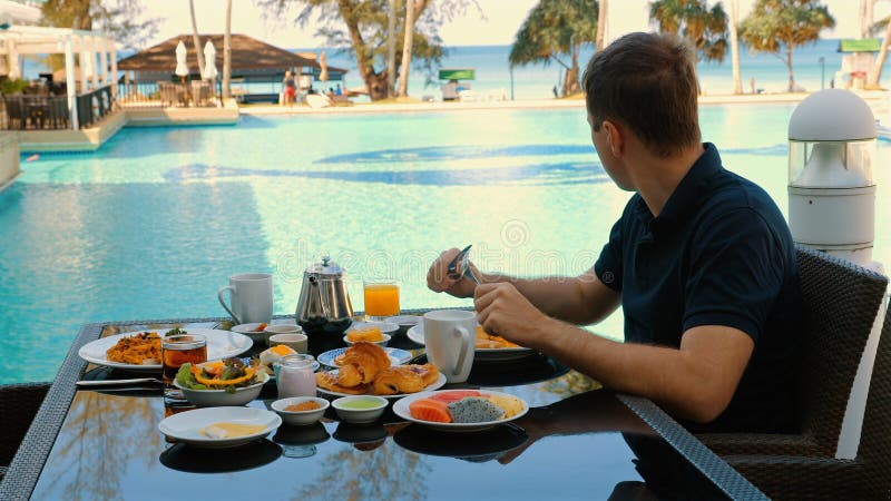 Man Enjoying Lavish Breakfast Buffet with Stock Image - Image of ...