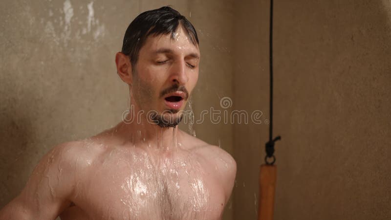 A Man Showering with a Beautiful Water Splashing Effect Creating a ...