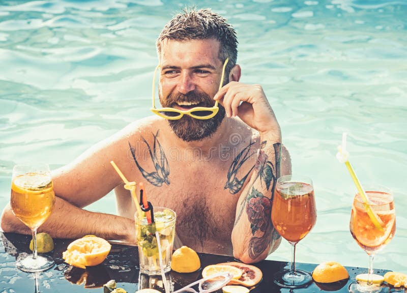 Man Enjoying and Relaxing in Swimming Pool with Cocktail. Stock Image ...