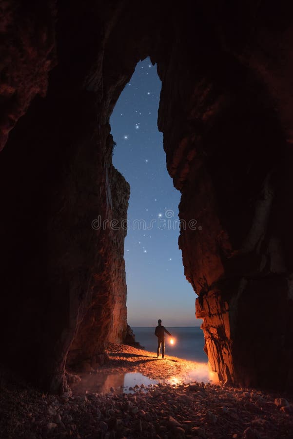 Man Enjoying the Starry Sky View from a Cave Stock Photo - Image of ...