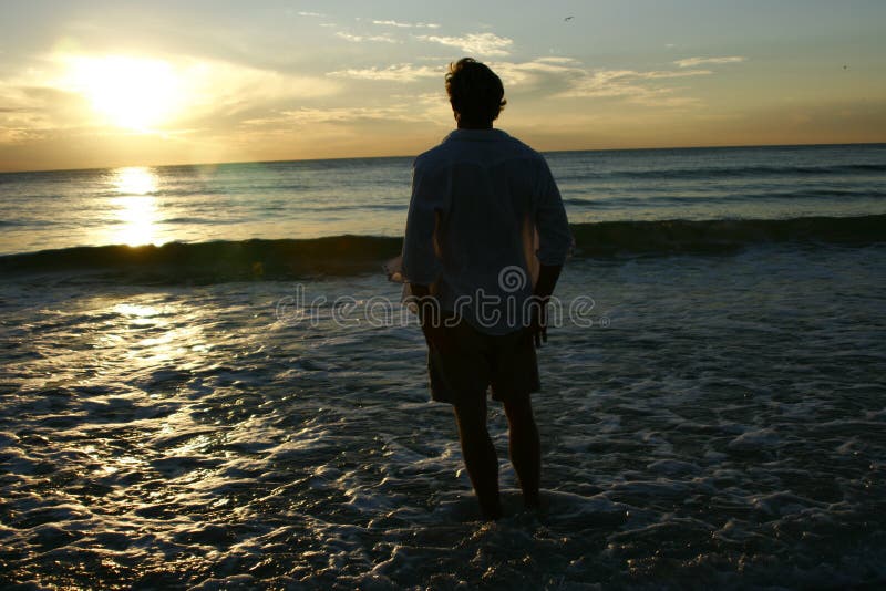 Man enjoying sunset stock image. Image of beach, sunset - 2037883