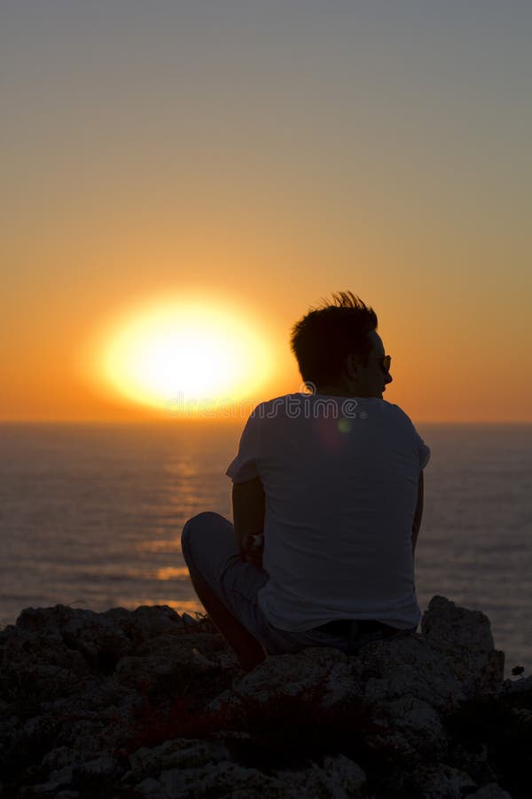 Man enjoying sunset stock photo. Image of dusk, sitting - 32925130