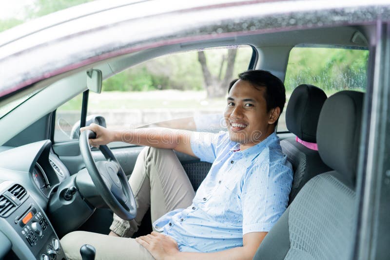 A Man Enjoying for Time Break Inside a Car Stock Photo - Image of ...