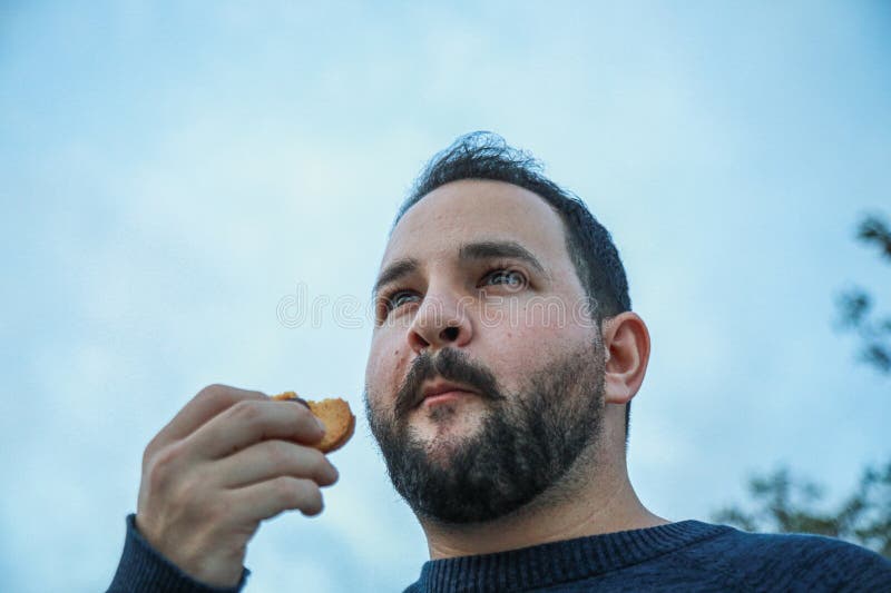 Man Enjoys the Perfect Biscuit Bite Stock Photo - Image of crunchy ...